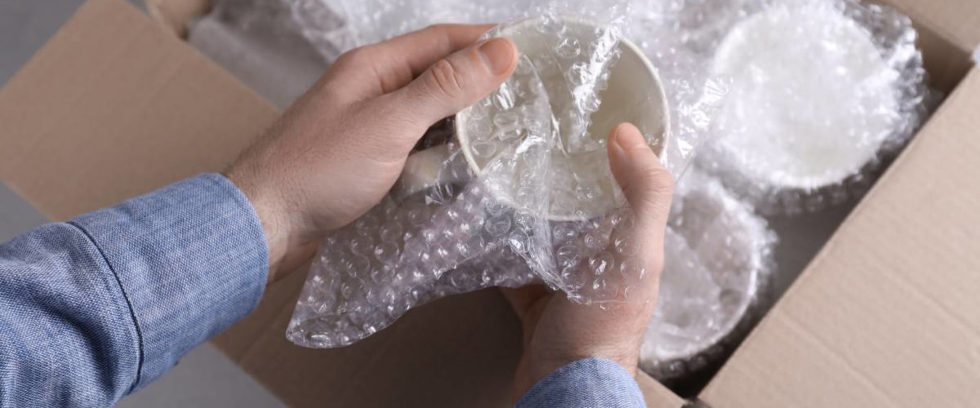 Wrapping Fragile Items in Bubble Wrap or Packing Paper
